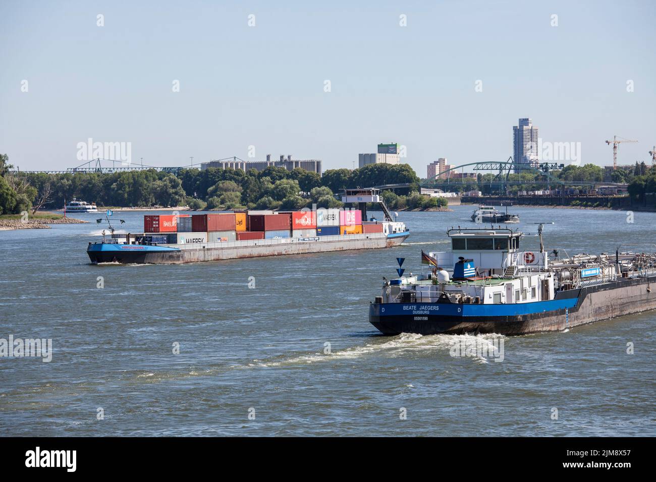 tanker vessel and container vessel on the Rhine in the towndistrict ...