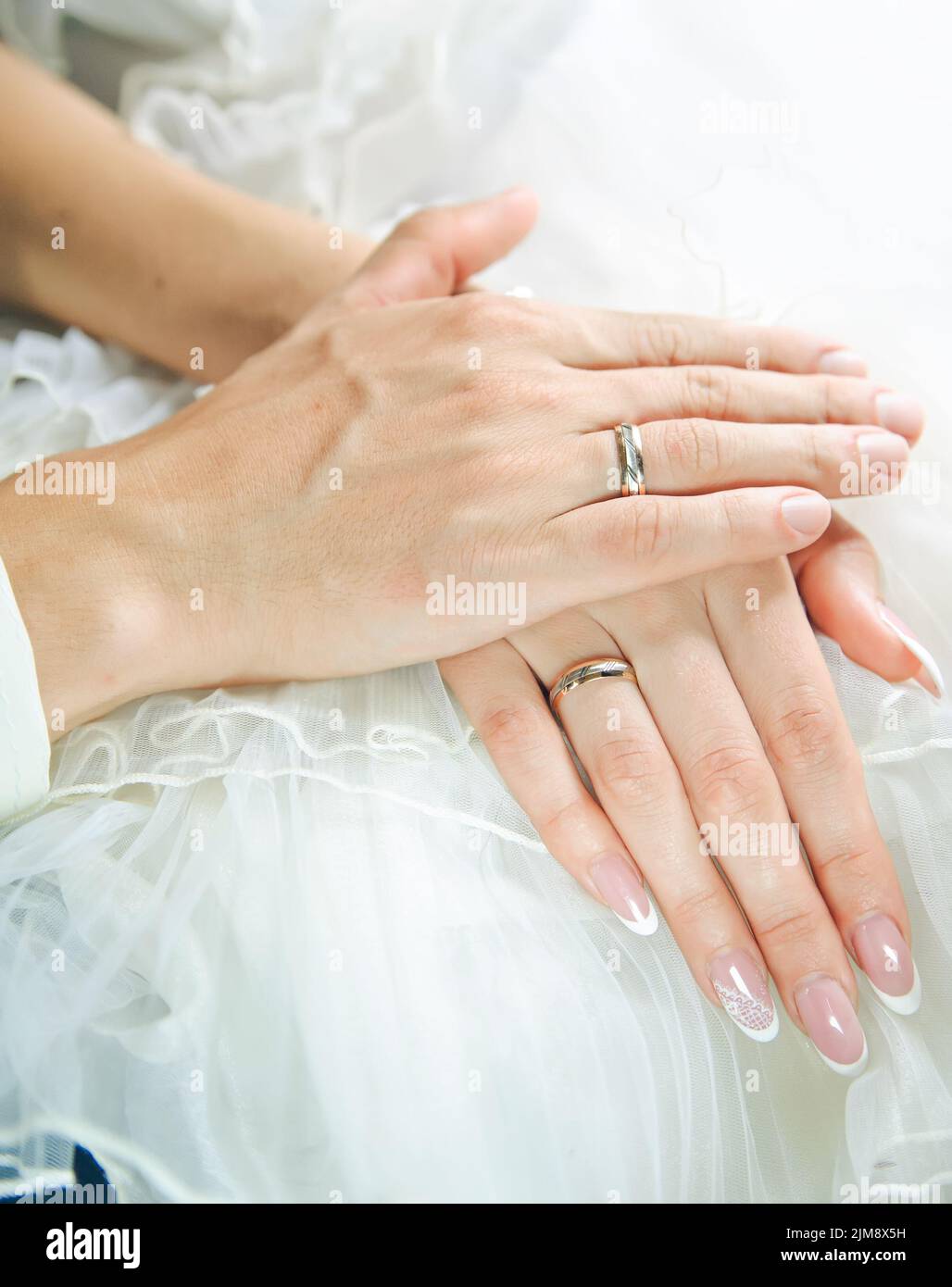 Bridegroom hands on a bride hands. Love and care Stock Photo - Alamy
