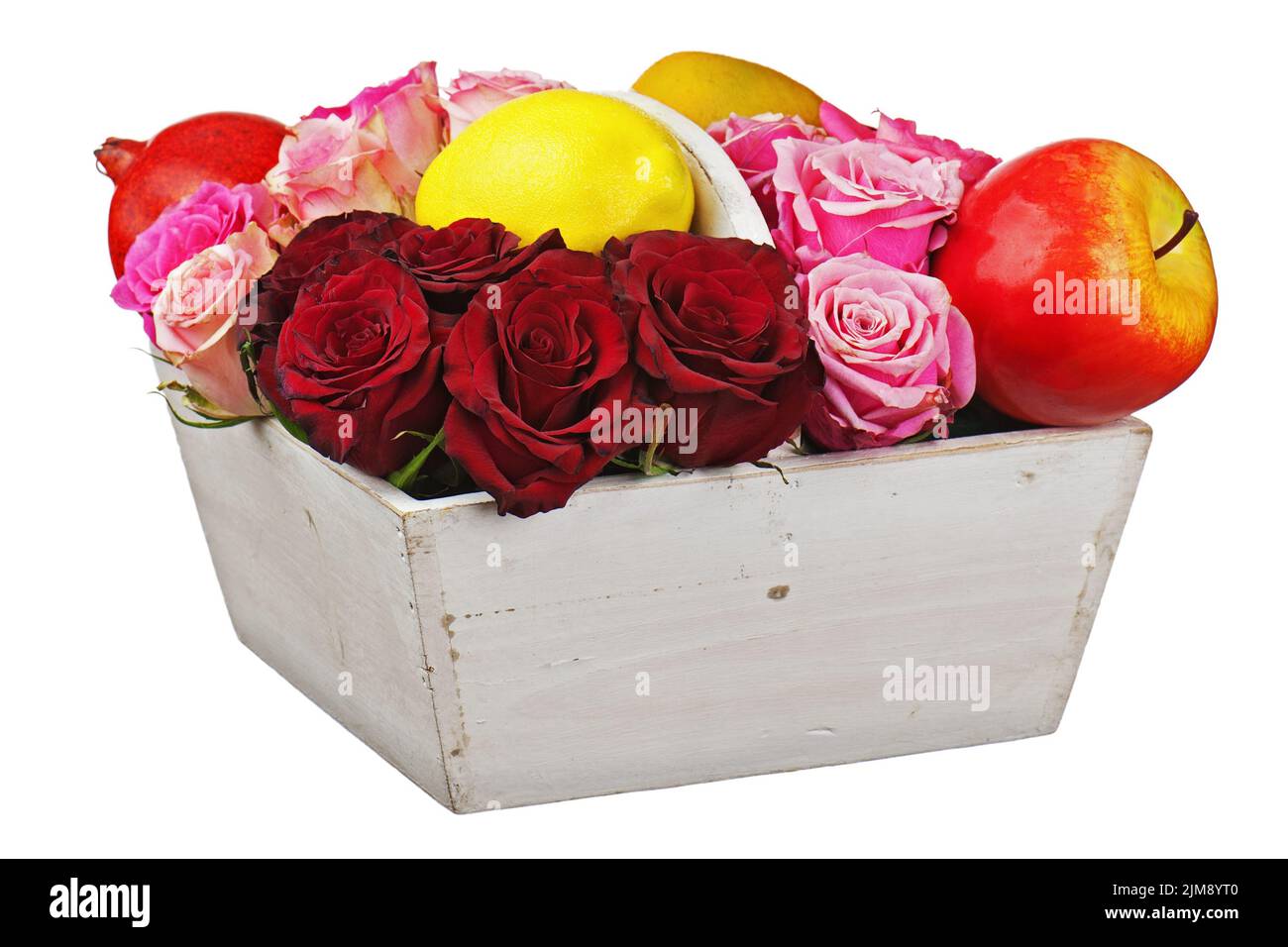 Flower arrangement of red roses and fruits in wood Stock Photo - Alamy