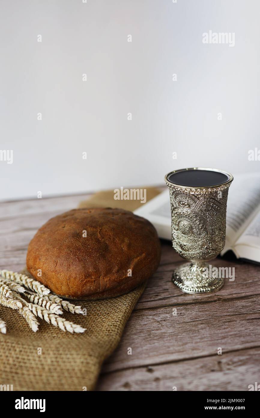 Chalice with wine and bread. Background with copy space. last supper ...