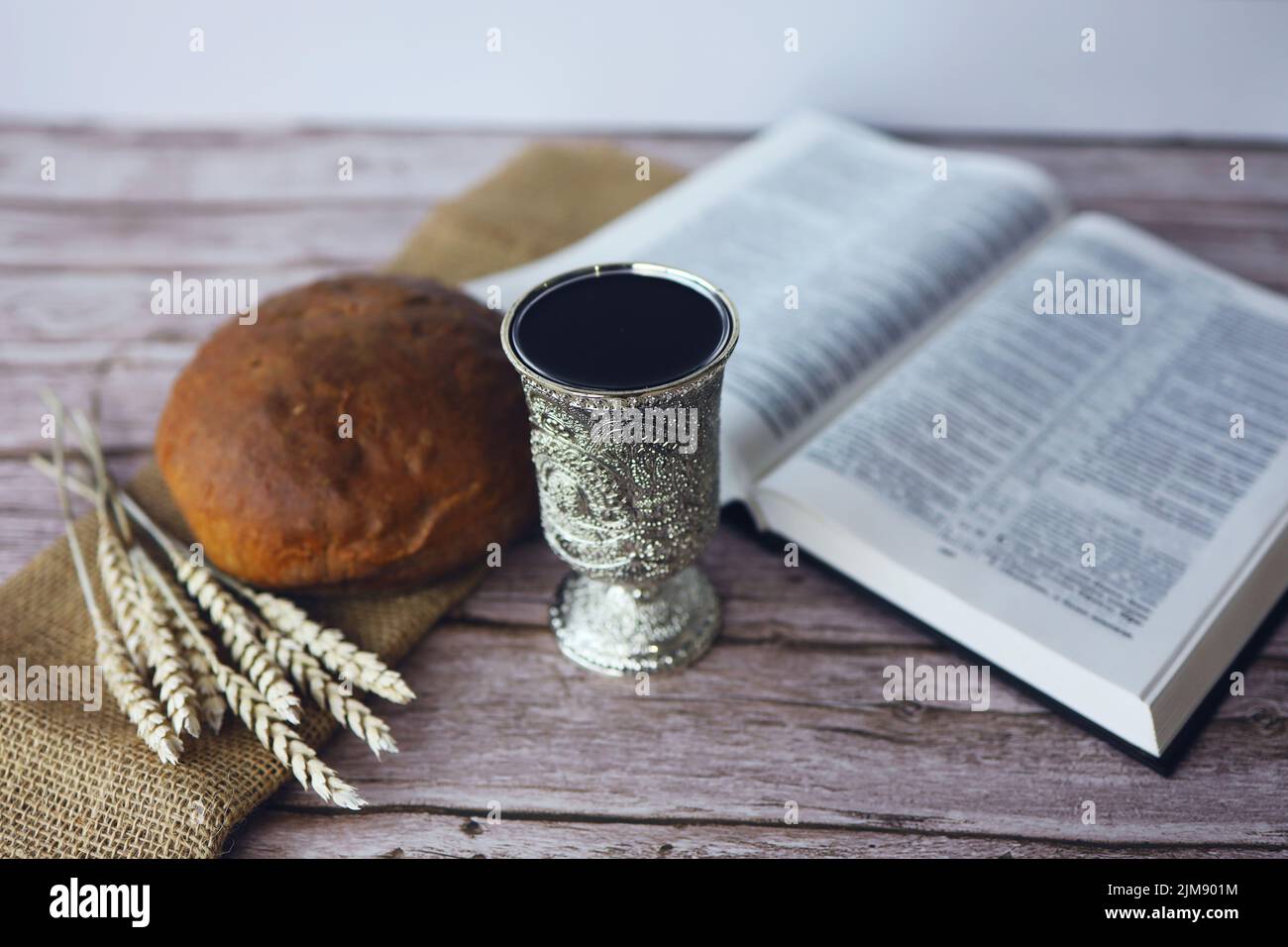 Chalice with wine and bread. Background with copy space. last supper ...
