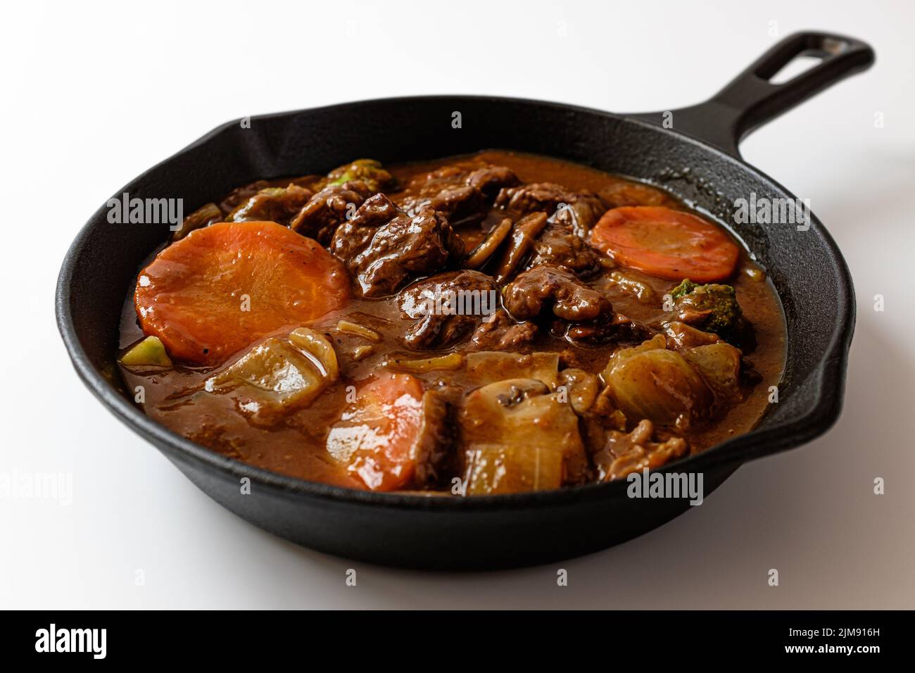 beef stew on a white background Stock Photo - Alamy
