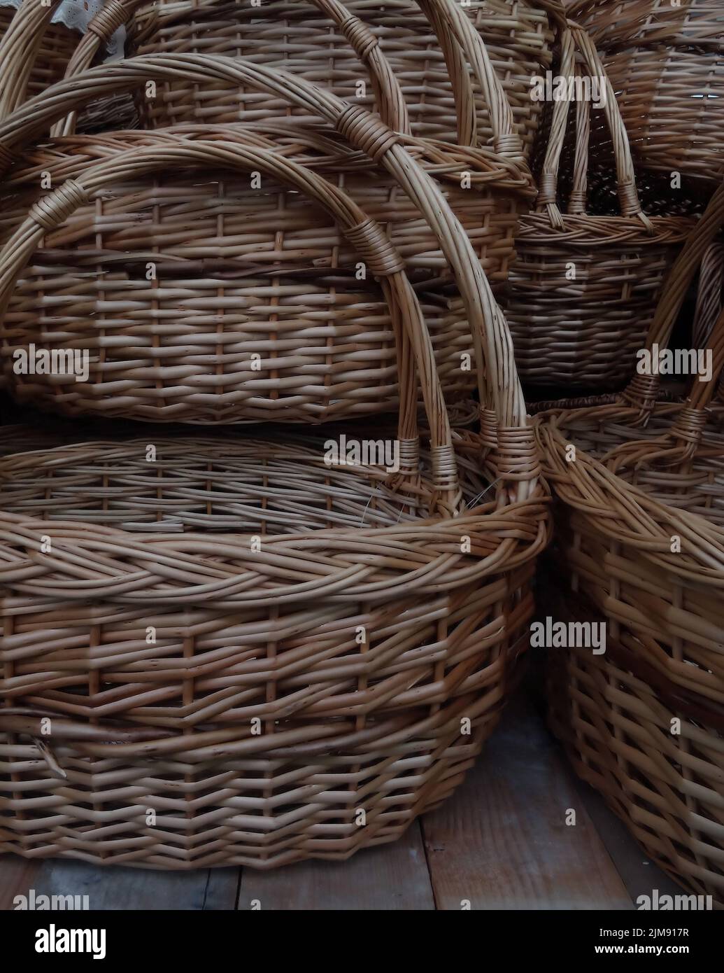 Traditional handicraft of woven baskets with wicker handles Stock Photo ...