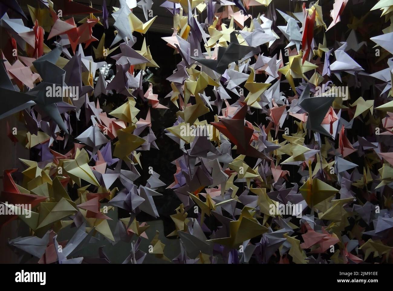 Handmade colorful paper craft cranes on a strings Stock Photo - Alamy