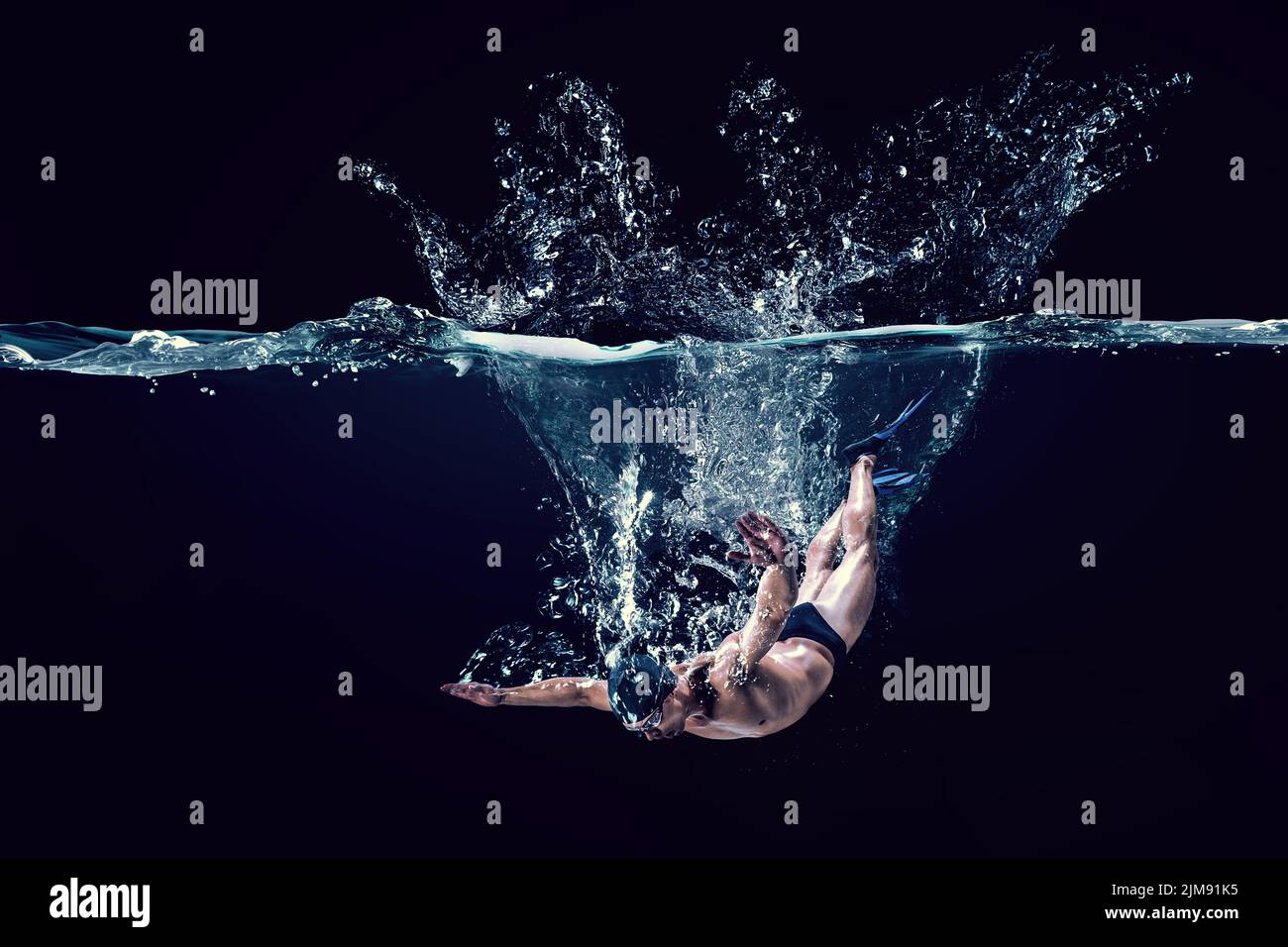 Professional man swimmer on a wave Stock Photo - Alamy