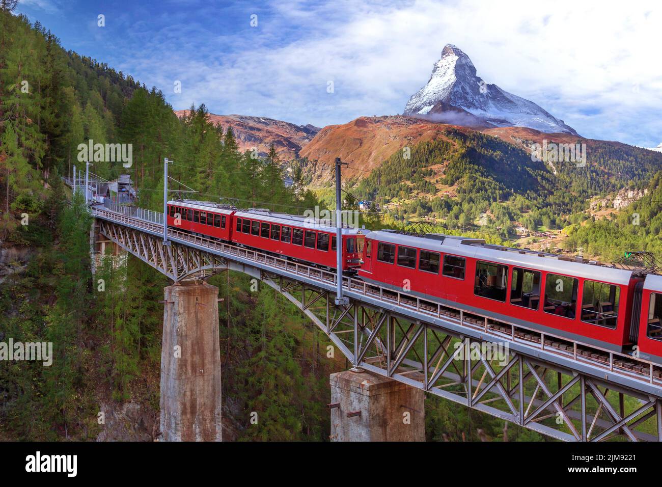 Zermatt, Switzerland. Gornergrat red tourist train on the bridge and ...