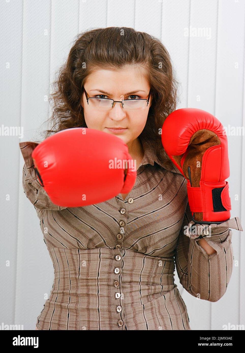 Business woman with boxing gloves Stock Photo - Alamy