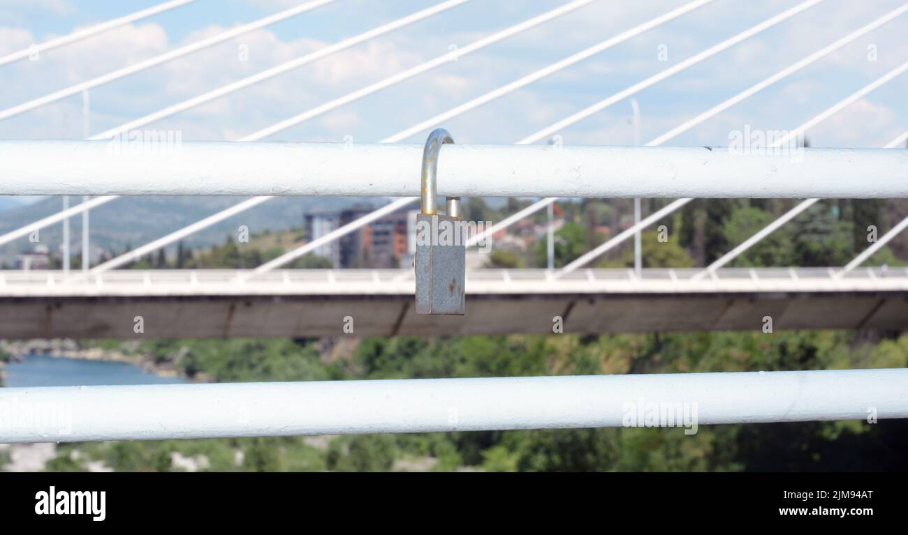 a lock on a white bridge handle Stock Photo - Alamy
