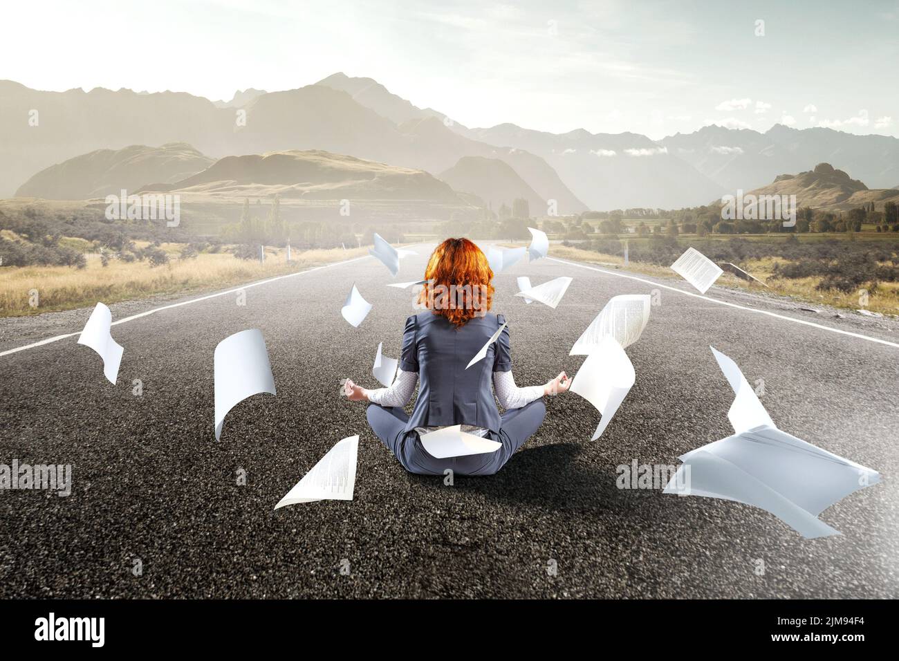 Beautiful businesswoman meditating . Mixed media Stock Photo - Alamy