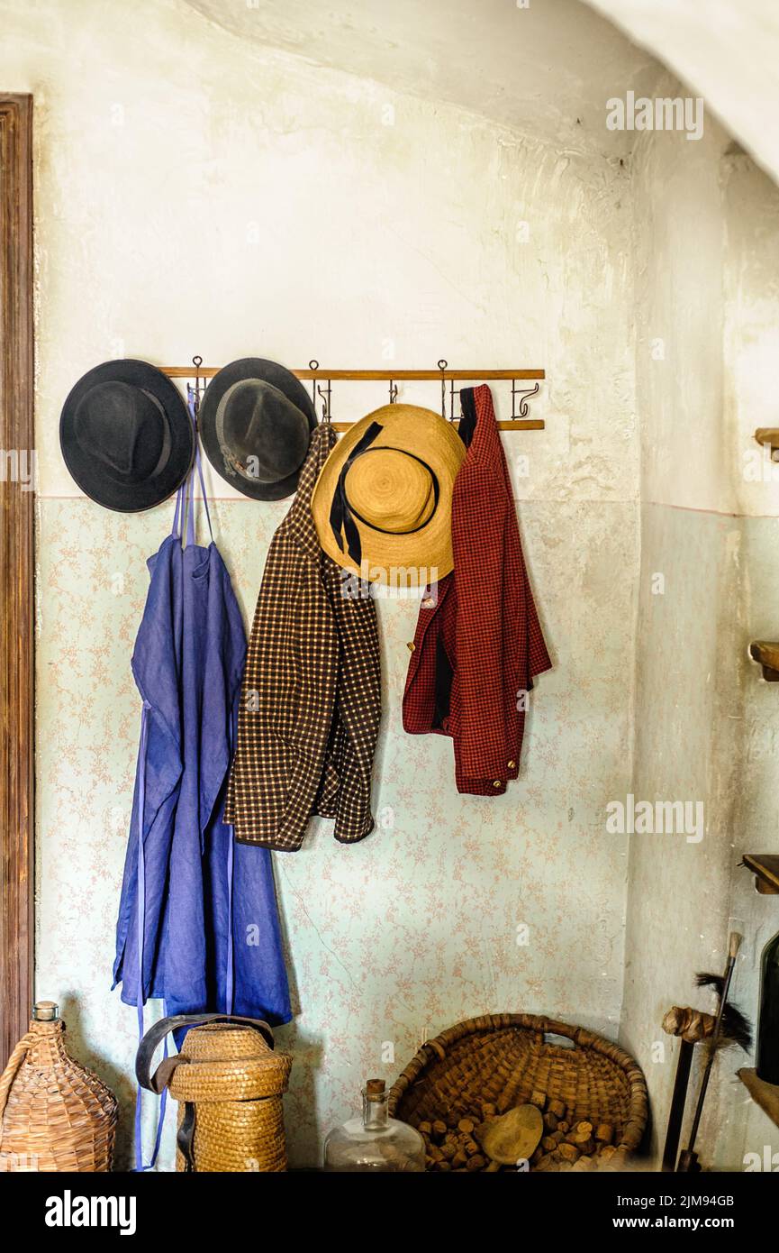 Rural Cloakroom with Clothes Stock Photo - Alamy