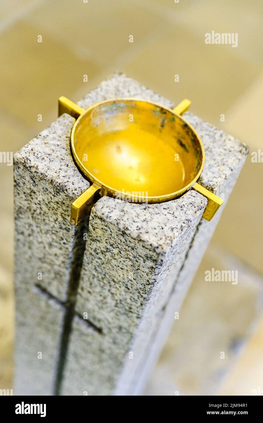 Holy water stoup in the church Stock Photo - Alamy