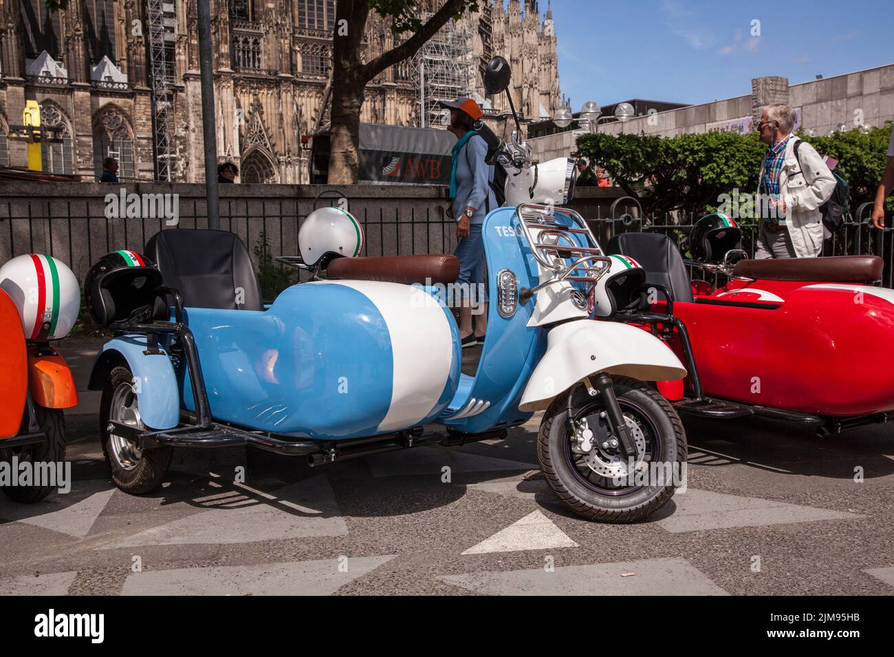 E-Vespina scooters with sidecars are available for rent for city tours ...