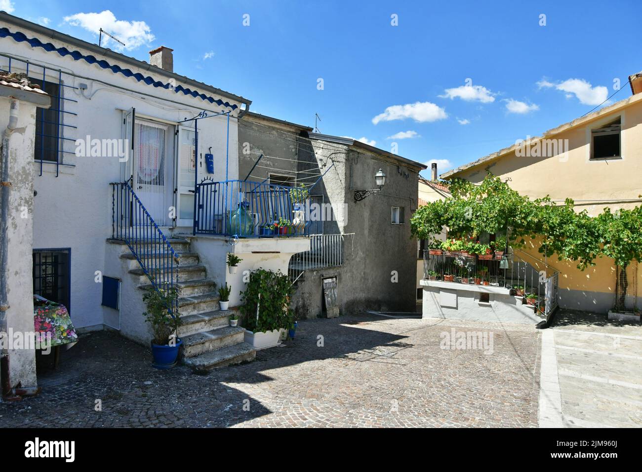 A narrow street among the old houses of Greci, a village in the ...