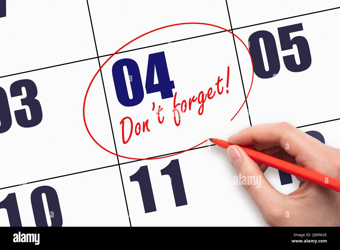 4th day of the month. Hand writing text DO NOT FORGET and circling the ...
