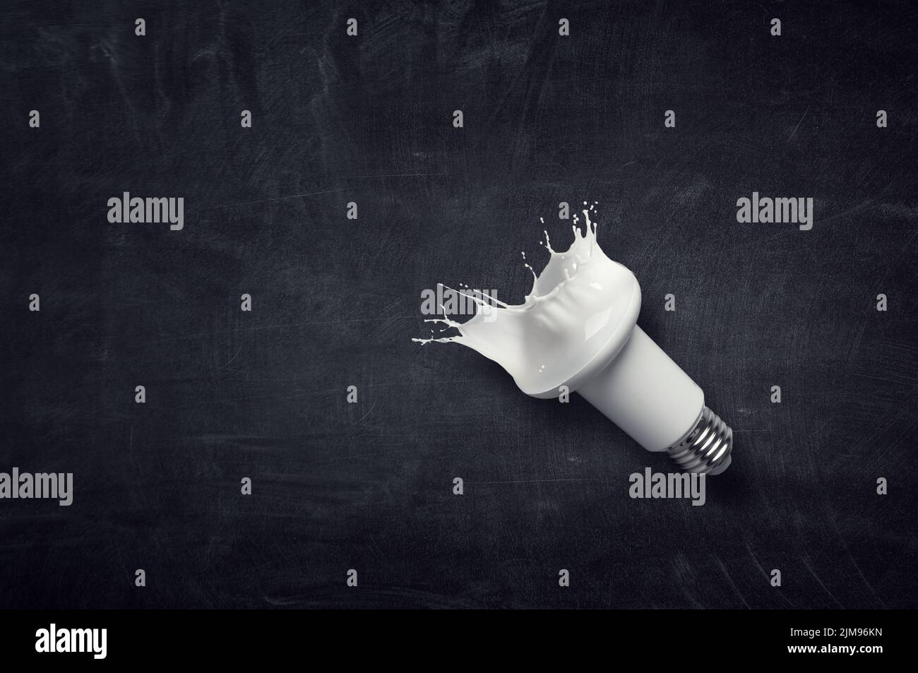 Light bulb with white glass splash Stock Photo - Alamy