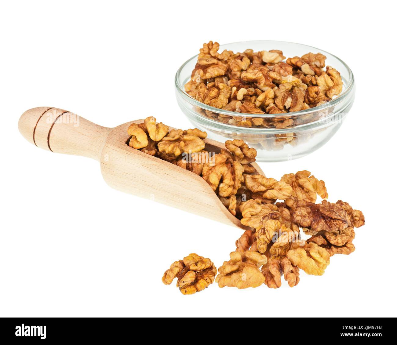 Handful of walnuts in scoop and glass bowl isolated on white Stock ...