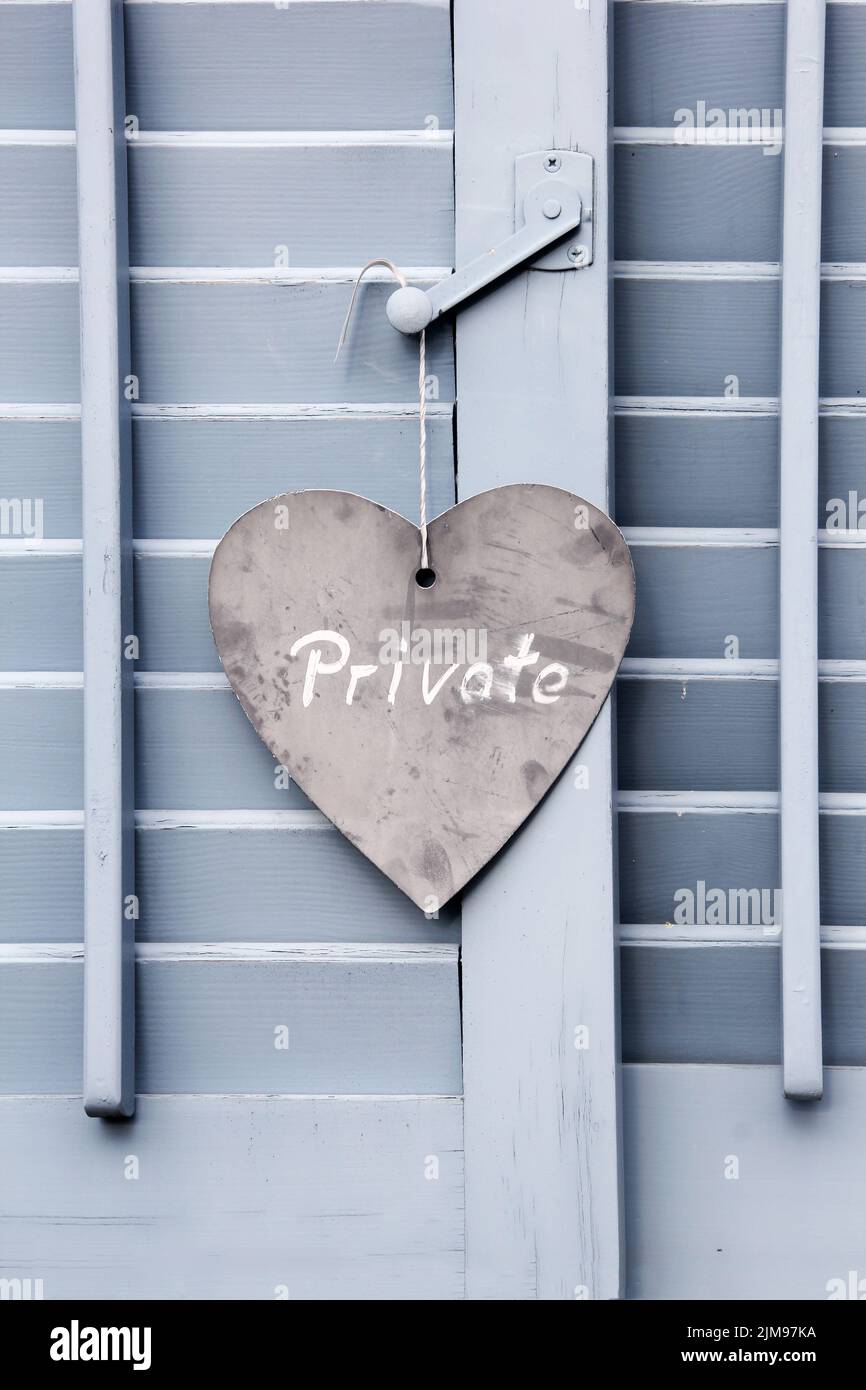 Private sign hanging outside of the window Stock Photo - Alamy