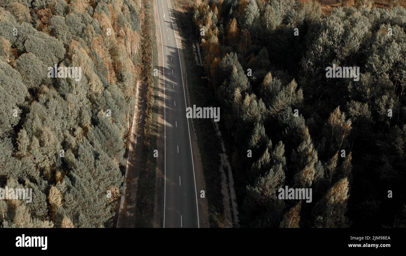 Asphalt road with traffic cars between forest in Ural, Russia ...