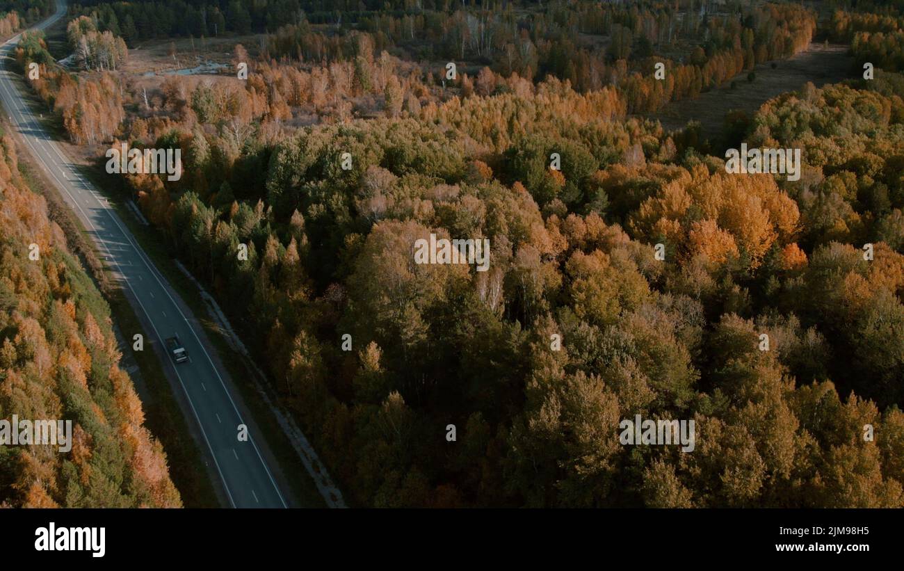 Asphalt road with traffic cars between forest in Ural, Russia ...