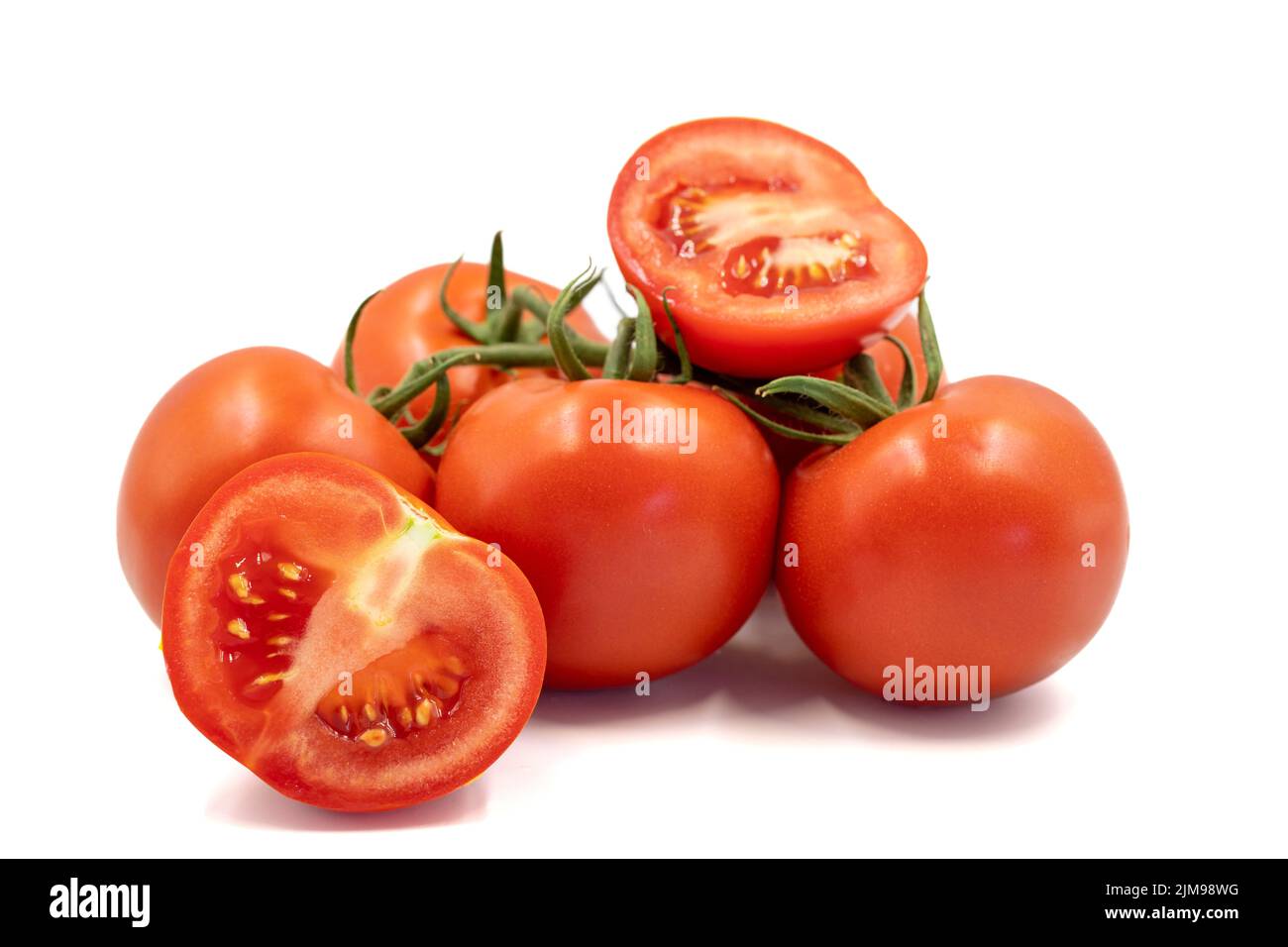 Bunch tomatoes. Freshly cut tomatoes isolated on white background ...