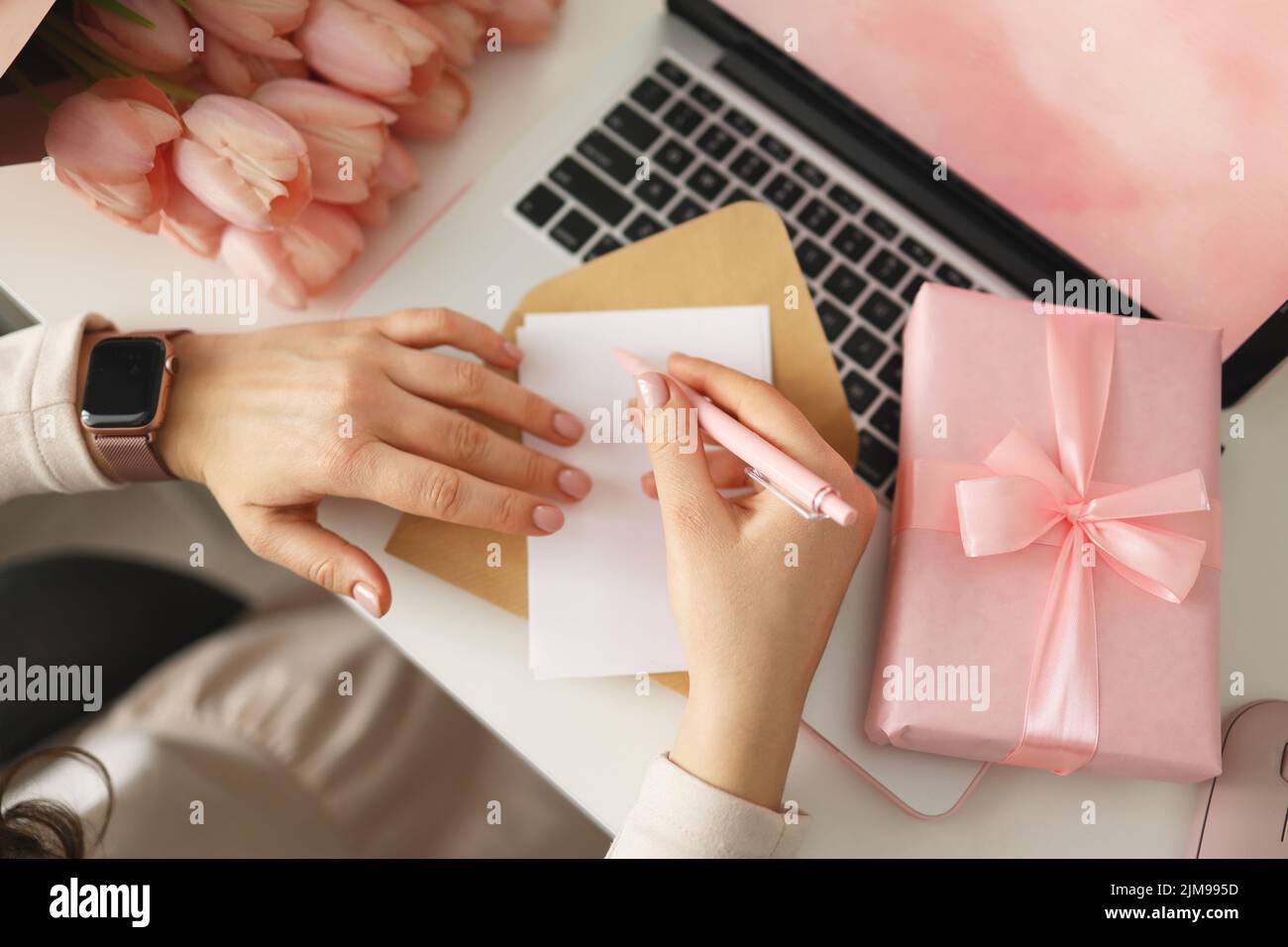 Female hands writing down wishes on latter paper for Valentines or ...