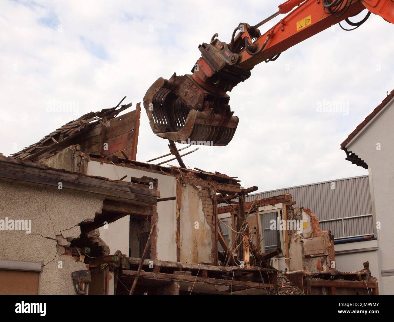 House demolition in a redevelopment area, excavato Stock Photo - Alamy