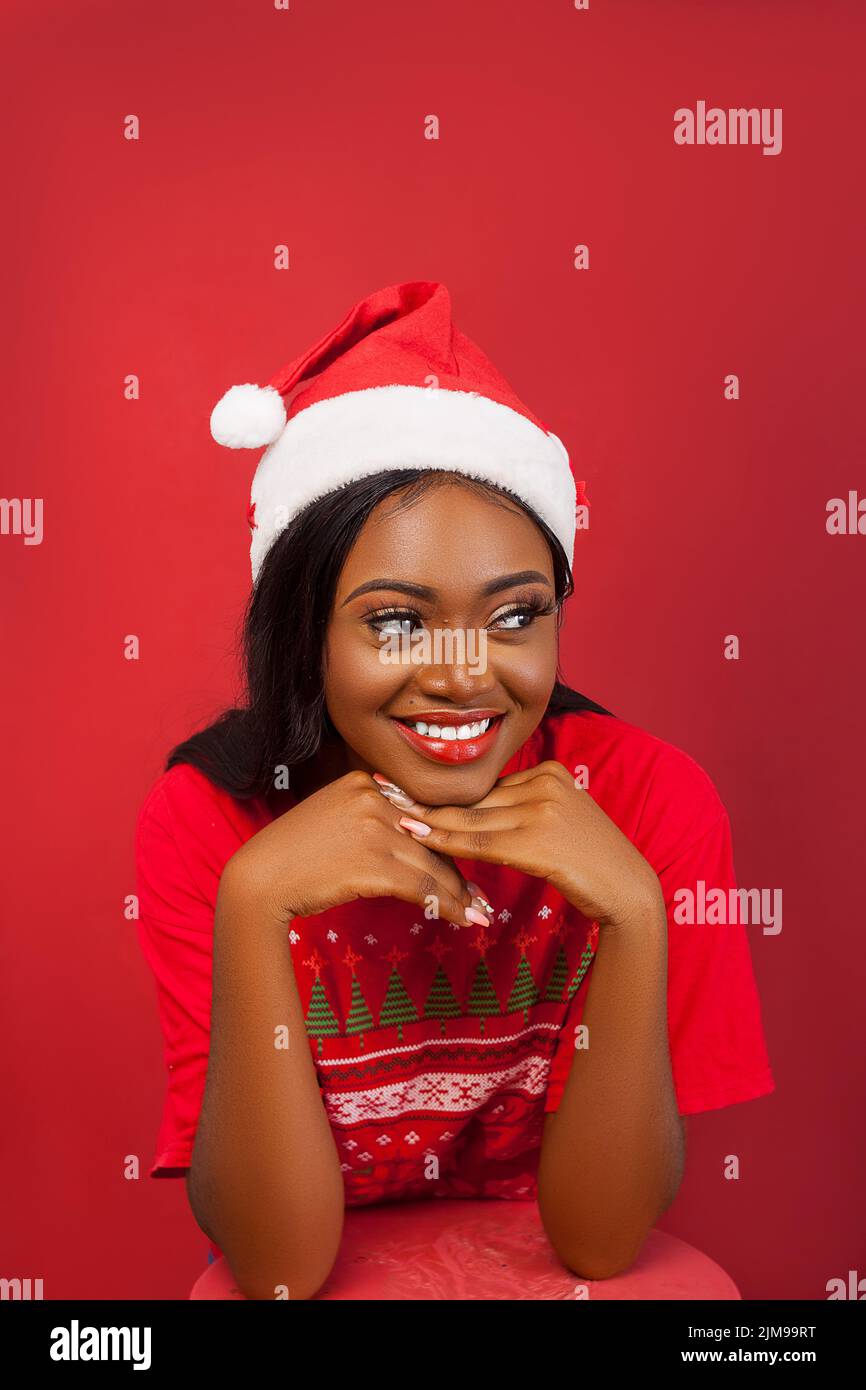 Christmas photoshoot with a beautiful lady in red smiling Stock Photo ...