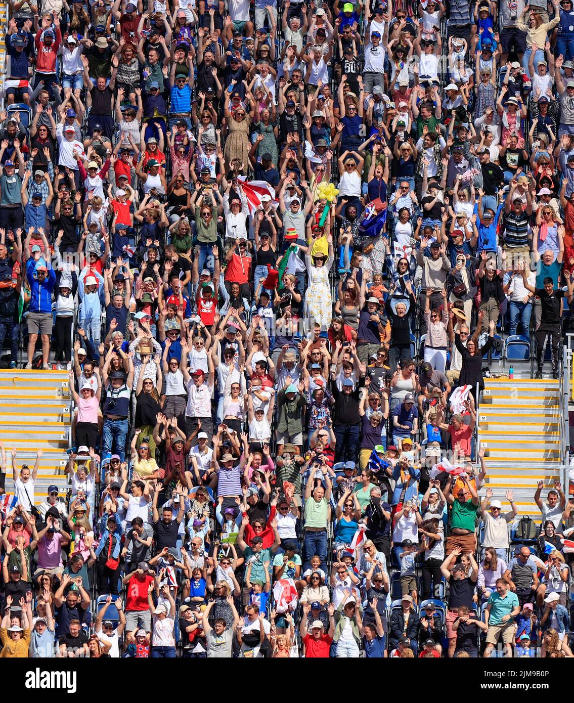 The Commonwealth Games crowd perform a Mexican wave Stock Photo - Alamy