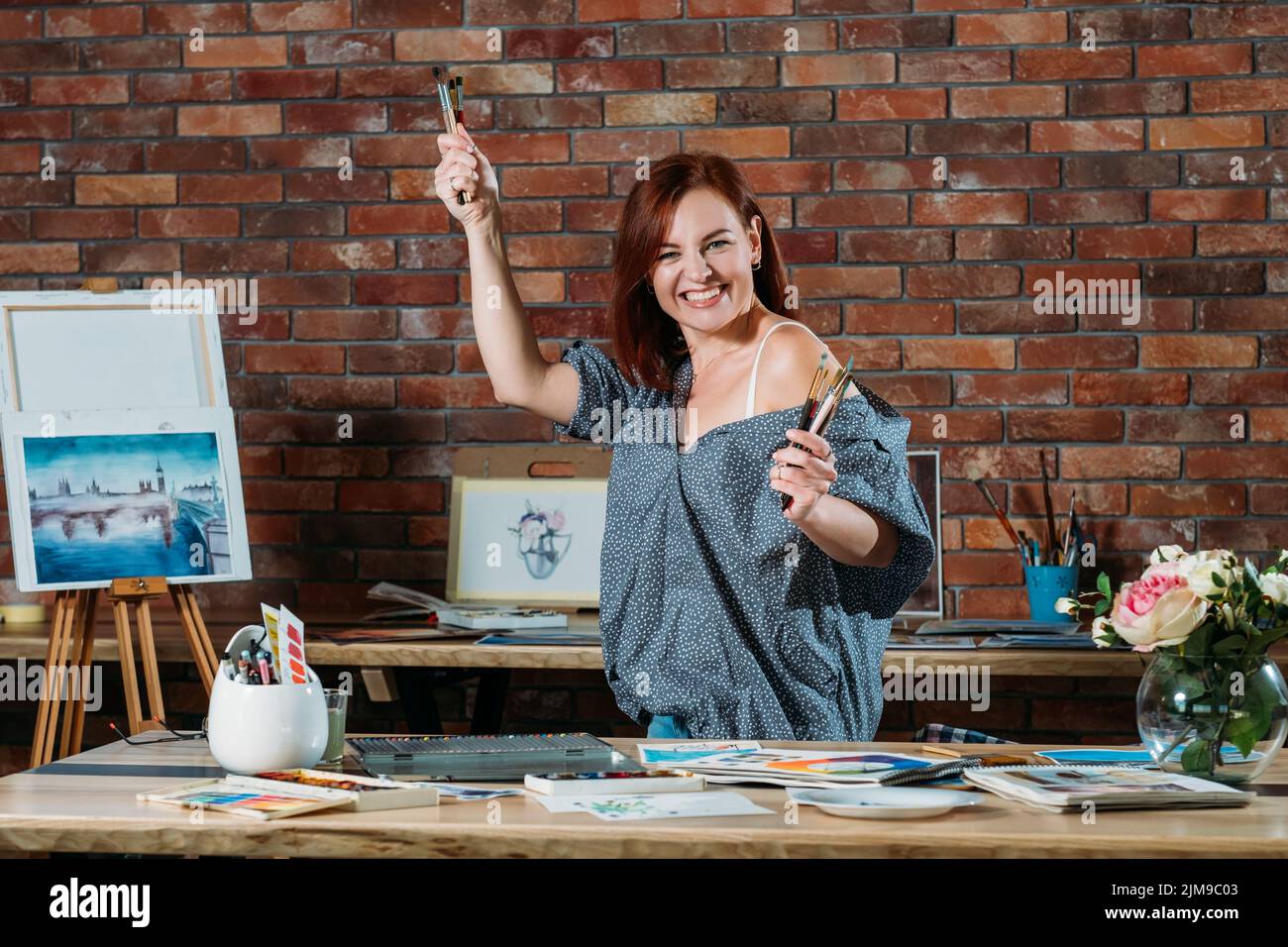 art hobby studio workspace female paintbrushes Stock Photo - Alamy