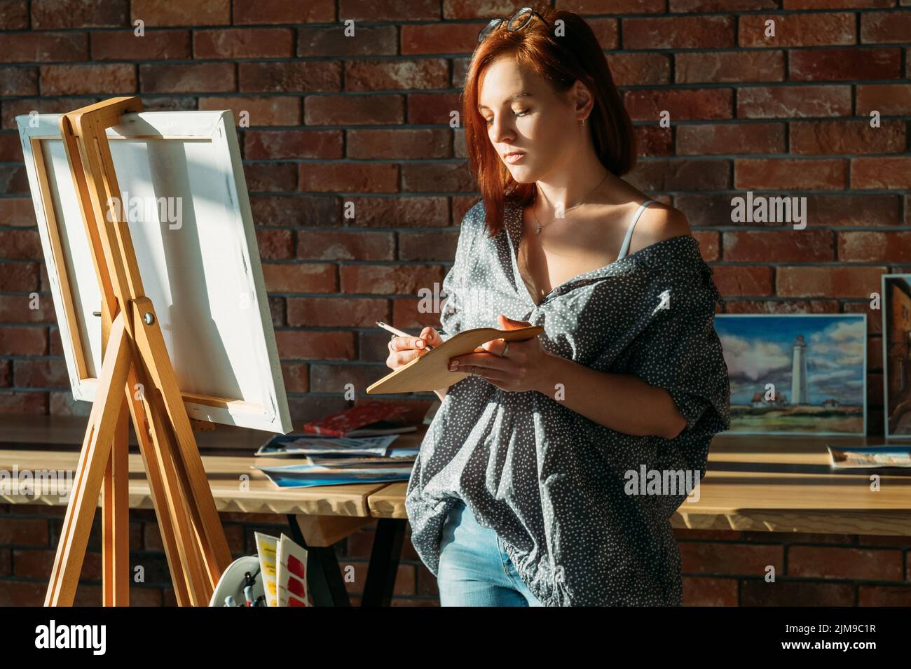 artist painting studio workspace easel mix palette Stock Photo - Alamy