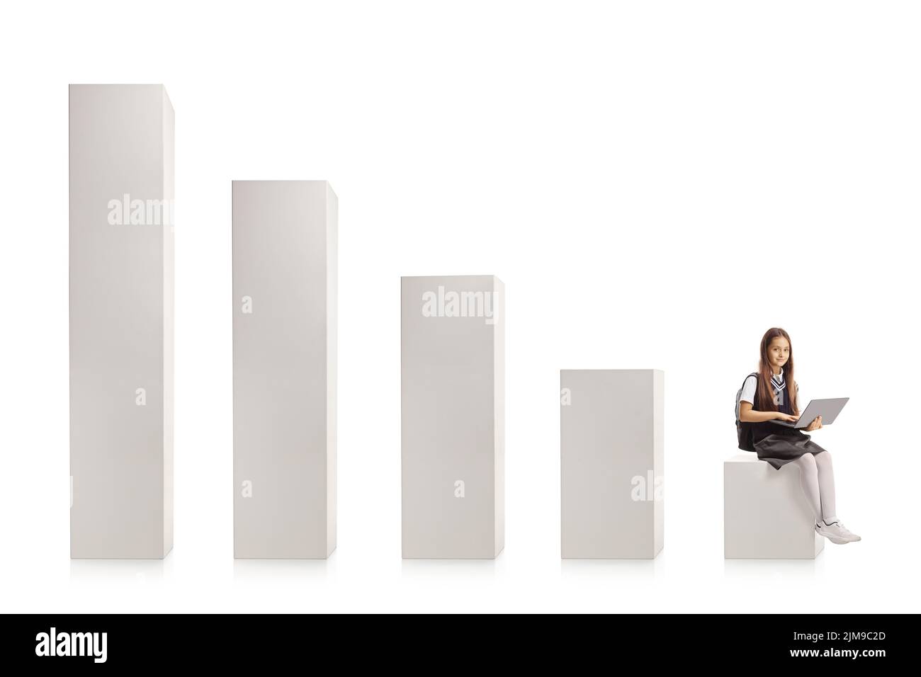 Schoolgirl sitting on a bar chart with a laptop computer isolated on ...