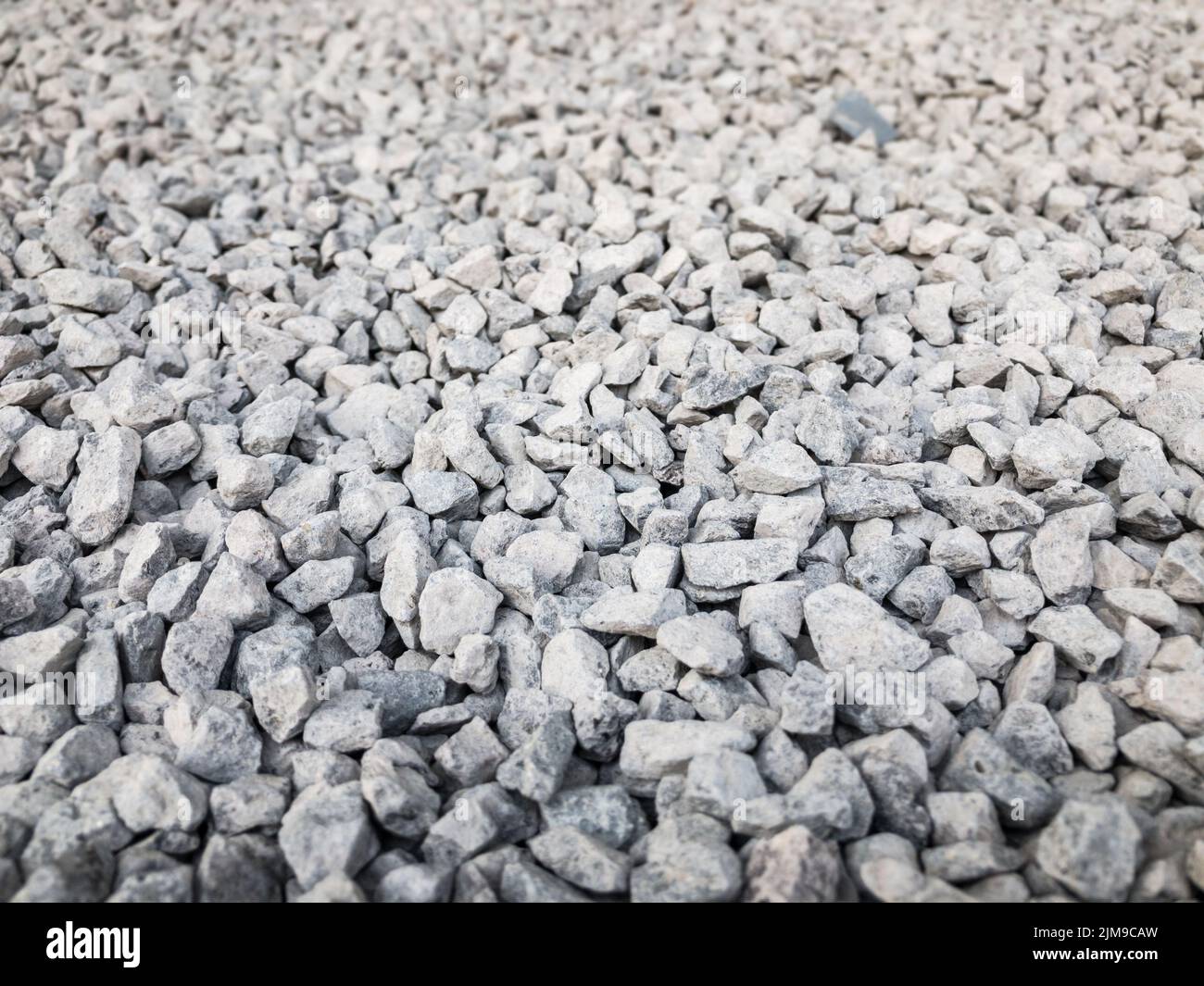 Full frame view of pebbles or basalt chippings as background or ...