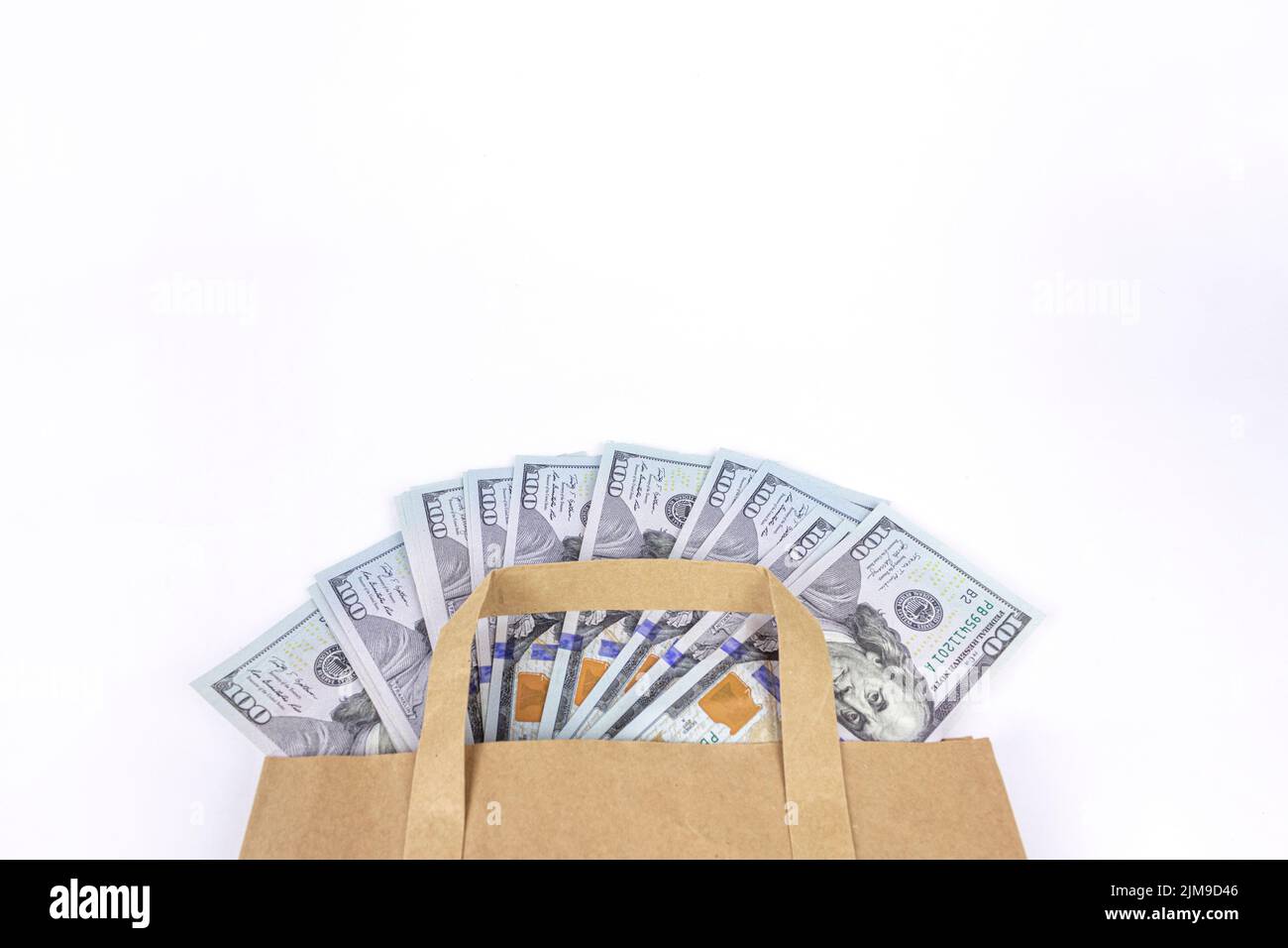 Package bag delivery with 100 dollar Banknotes, concept finance and ...