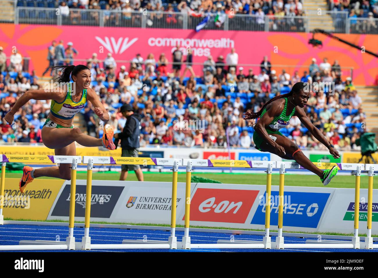 Tobi Amusan of Nigeria leads from Michelle Jenneke of Australia in the ...