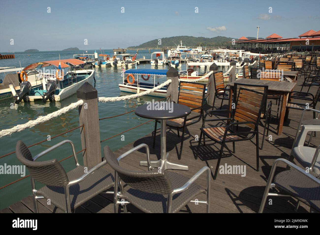 Boats and seascape are seen from from a seaside cafe on a viewing ...