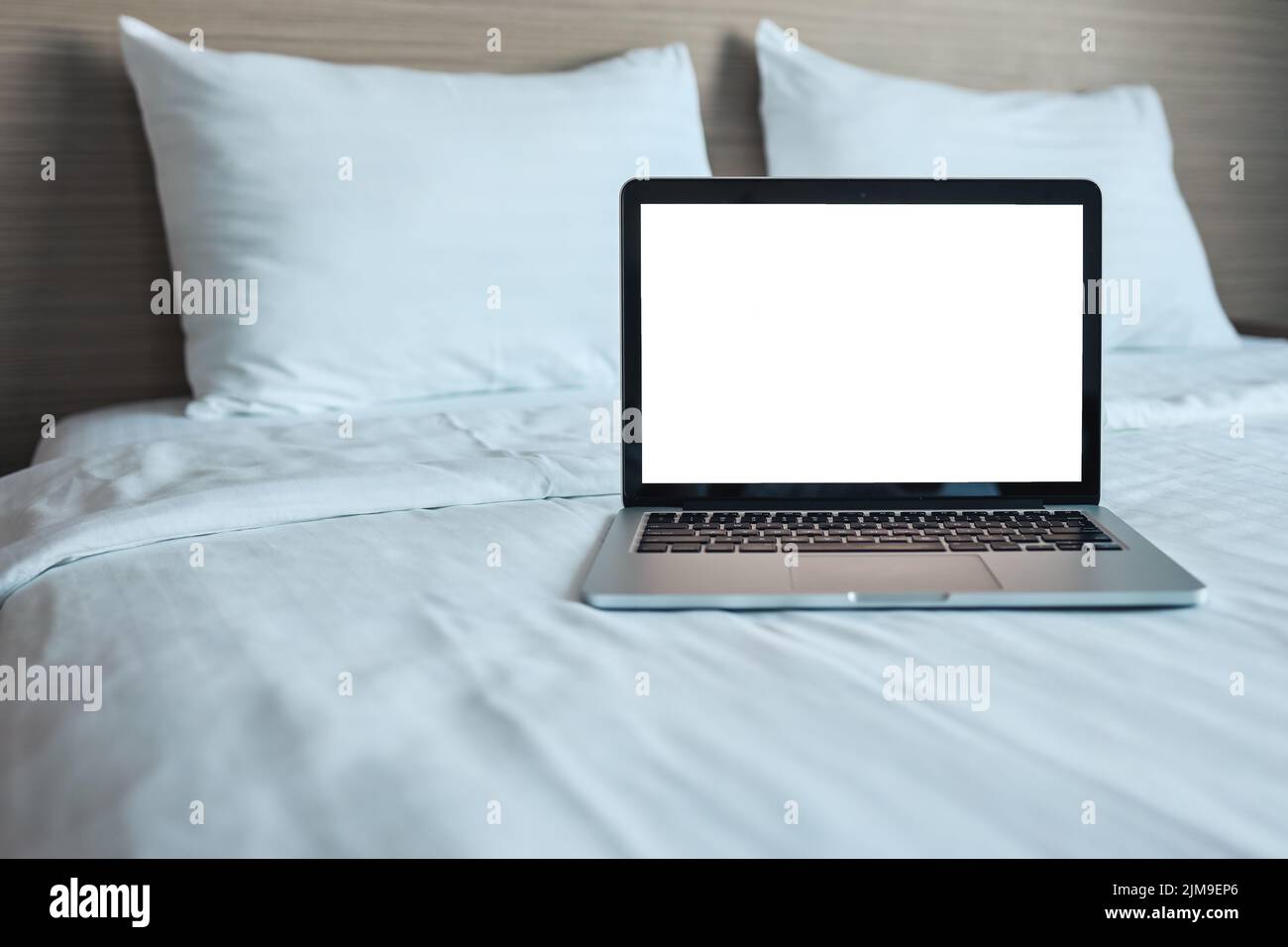 Mock up Blank screen laptop on the bed for advertising and text Stock ...