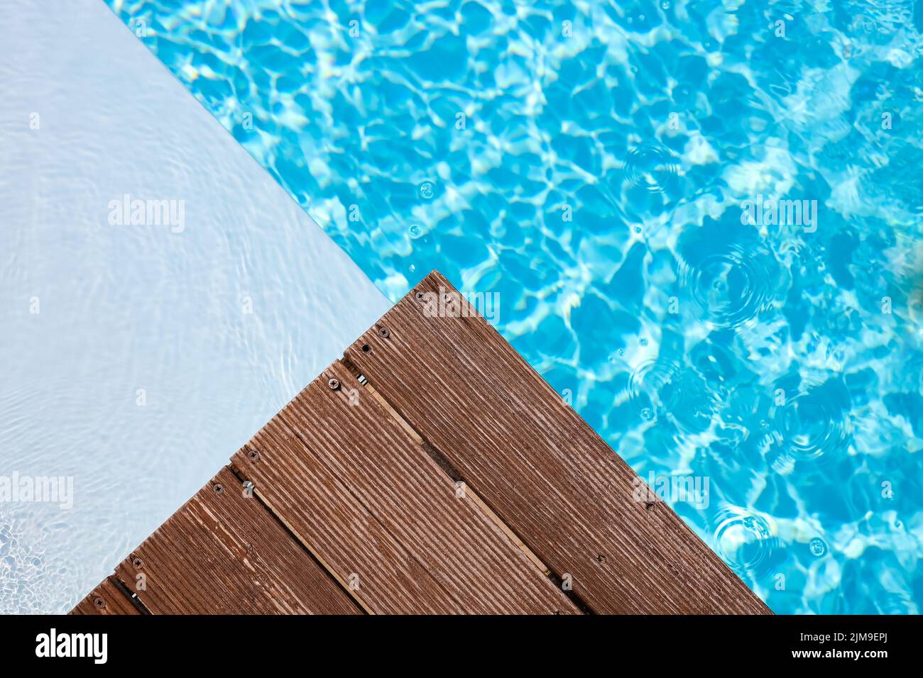 Wooden platform on swimming pool background. Pool background wallpaper ...