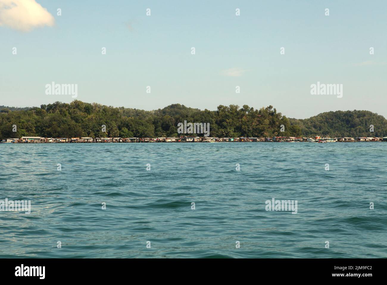 Stilt houses of a Bajau Laut (sea gypsy) community are seen from a boat ...