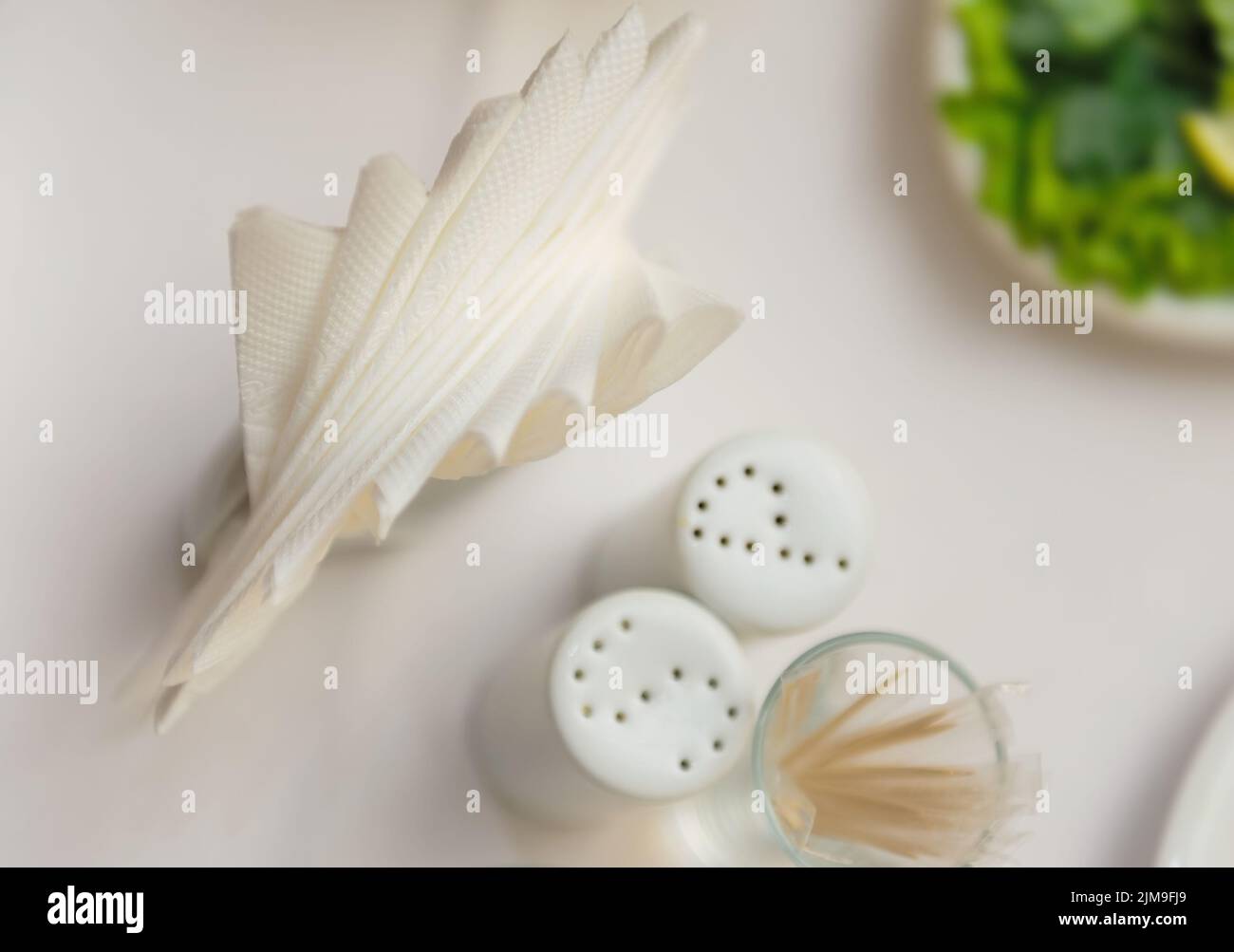 Clean white napkins with salt cellar and toothpick Stock Photo - Alamy