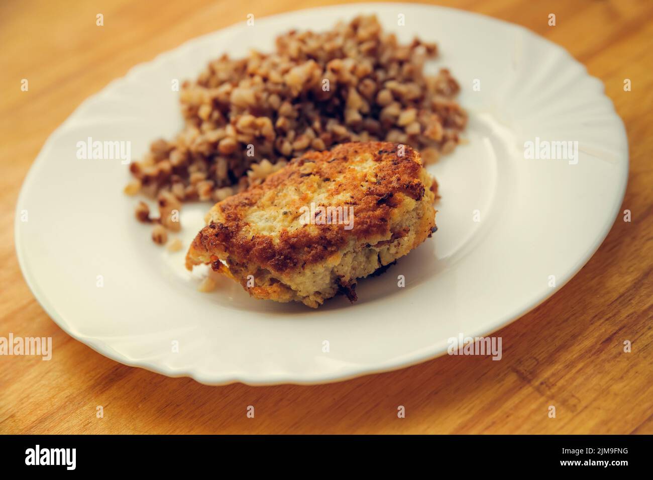 Economy food. rissole and buckwheat groats Stock Photo - Alamy
