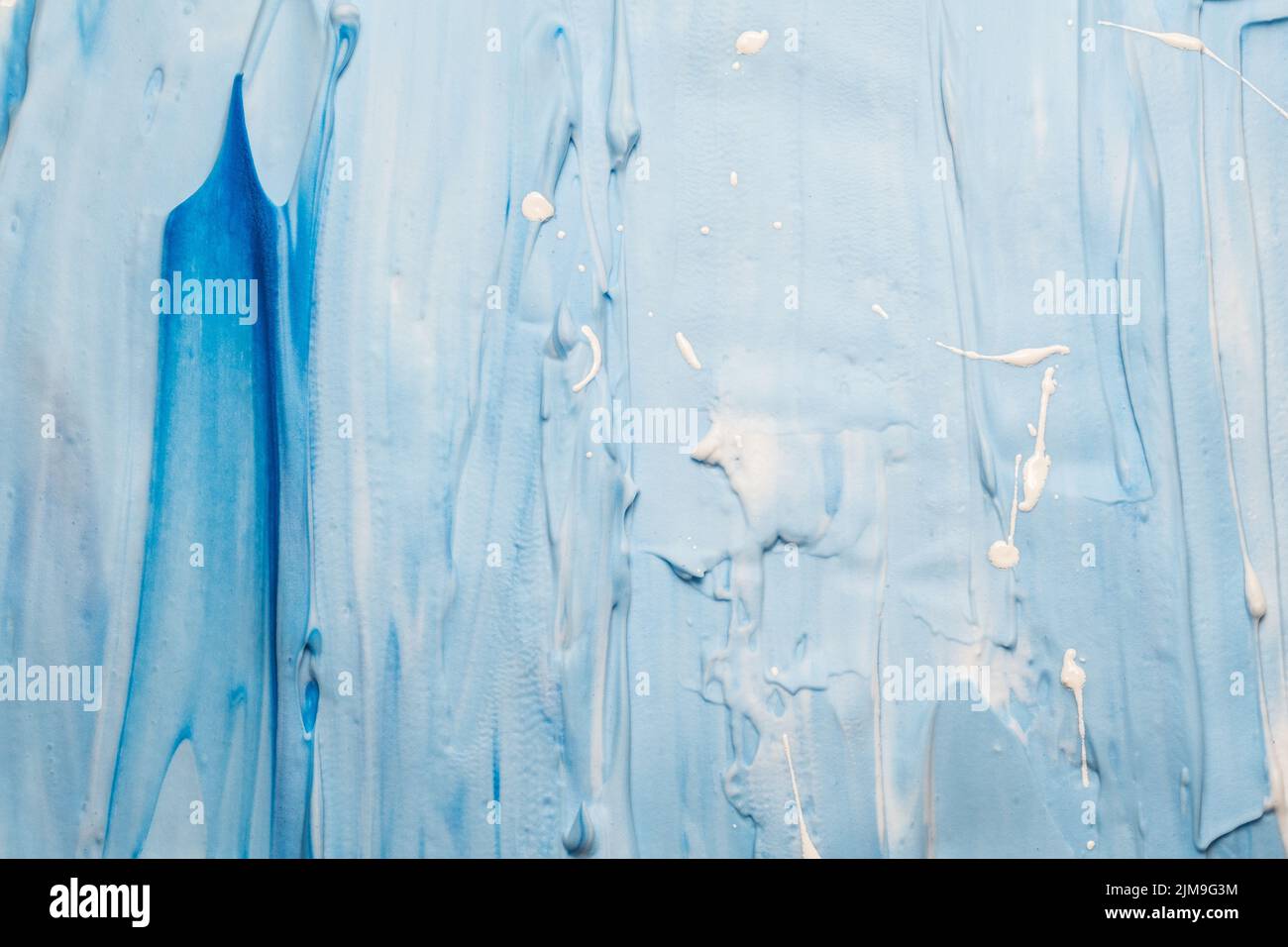 spilled blue paint background white splashes Stock Photo - Alamy