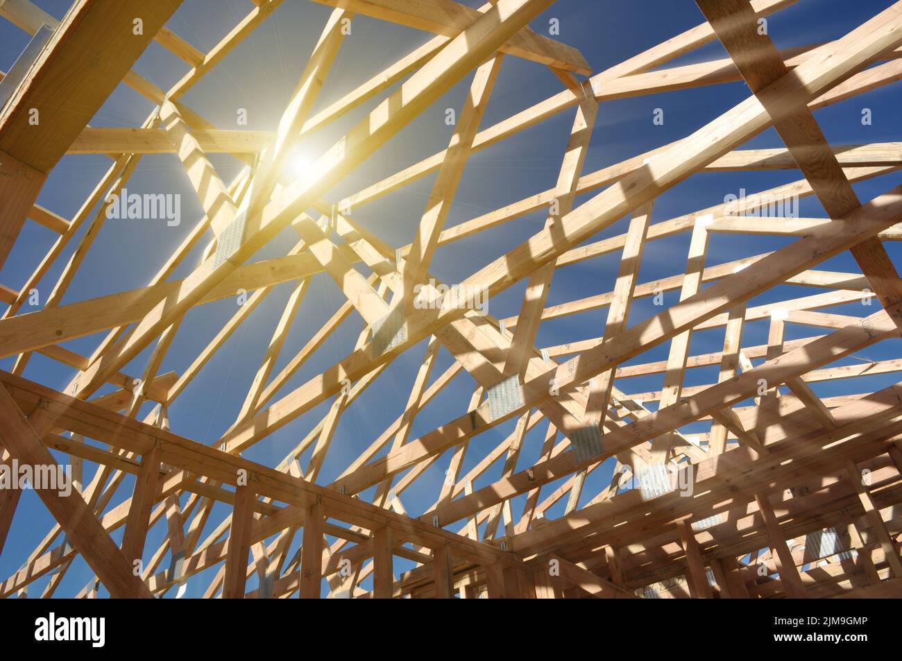 New Home Under Construction with Sunlight Stock Photo - Alamy