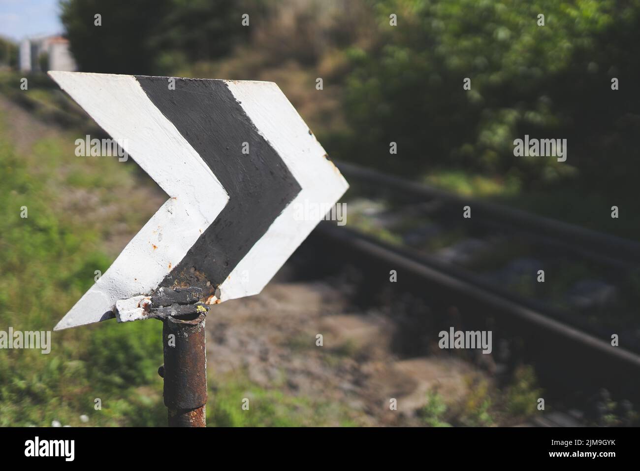 the old railway arrow shows the direction of travel for the train Stock ...