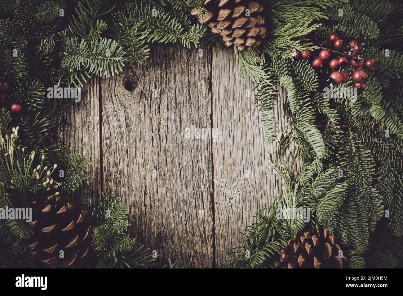 Christmas Wreath with Rustic Wood Background Stock Photo - Alamy