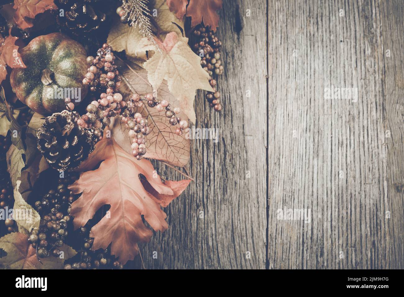 Autumn Leaves on Rustic Wood Background with Instagram Style Filter ...