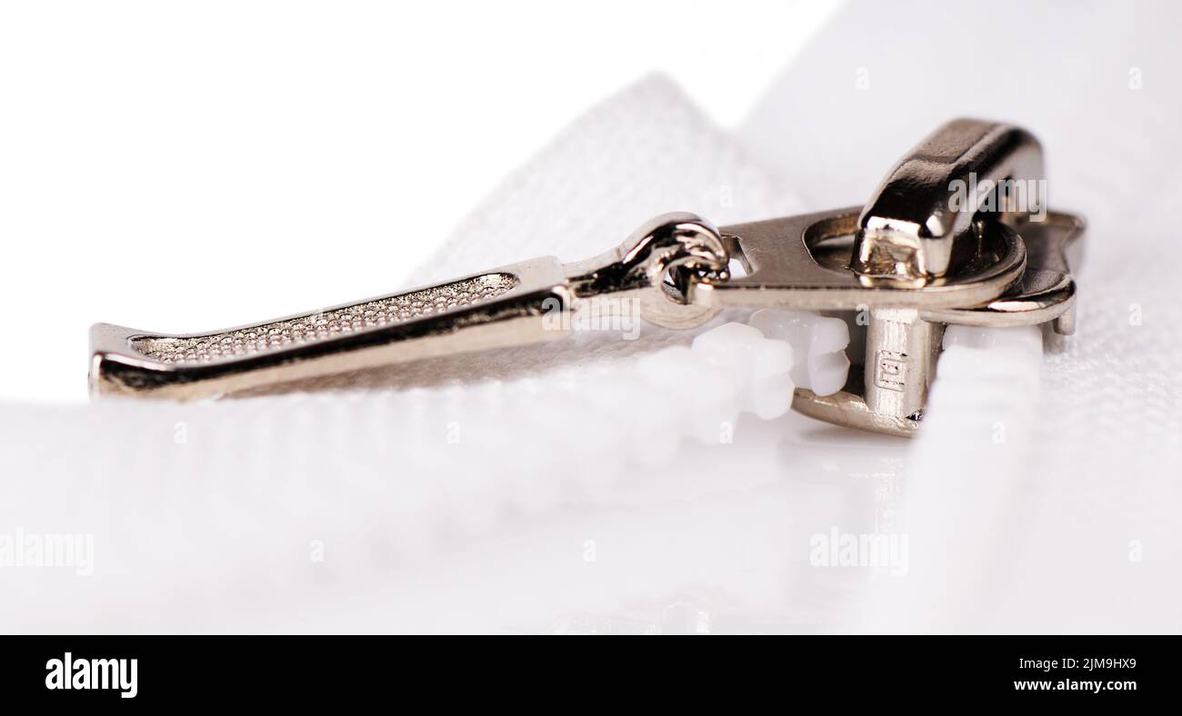 Metal and plastic zipper fastener close-up over white background Stock ...
