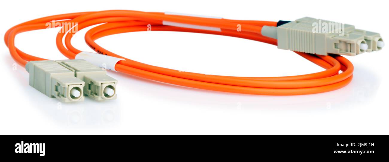 Orange optical data cable over white background Stock Photo - Alamy