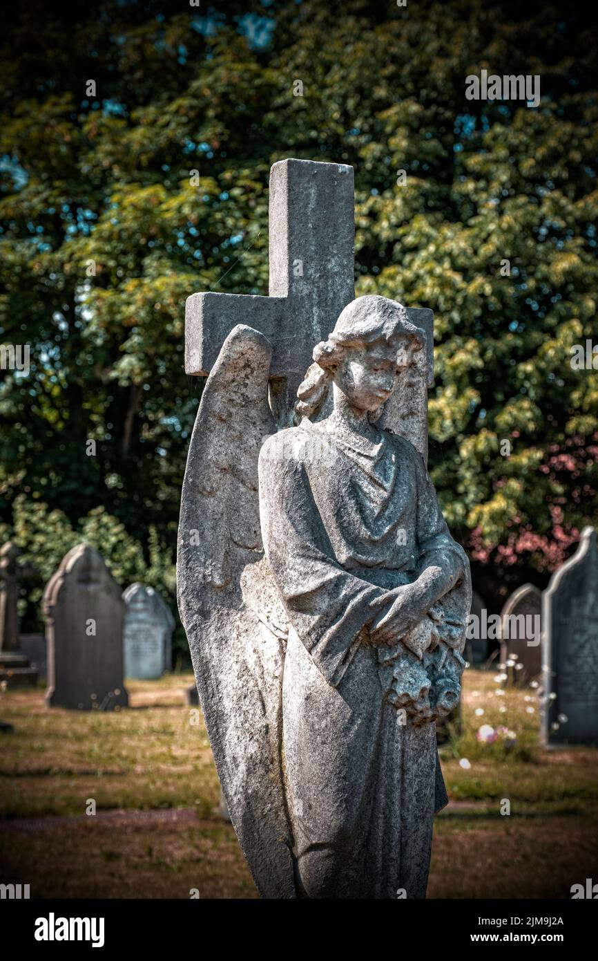 Statue of angel with the cross hi-res stock photography and images - Alamy