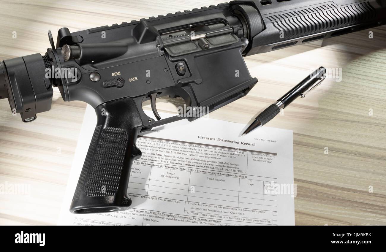 Assault rifle with public domain 4473 form for its purchase Stock Photo ...