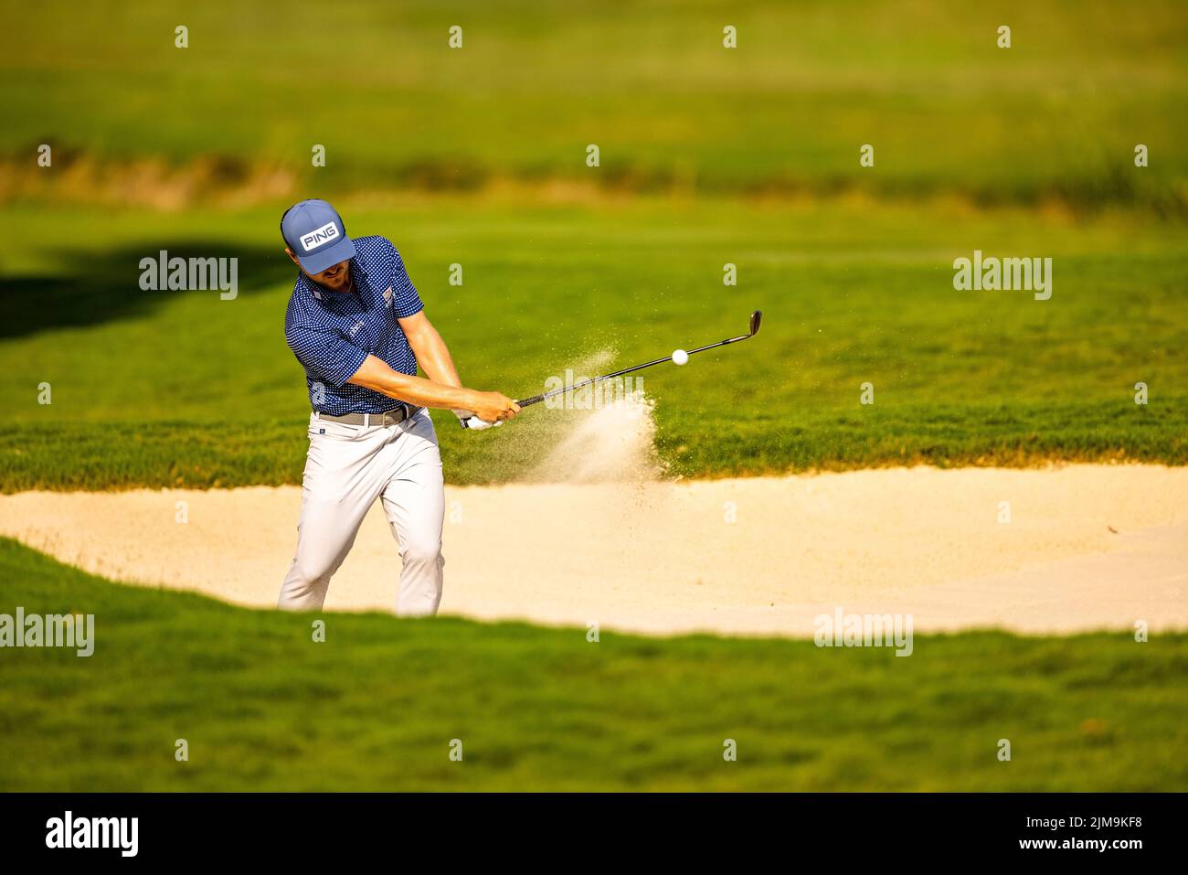 August 4, 2022: Austin Cook hits out of the bunker on 18 during the ...